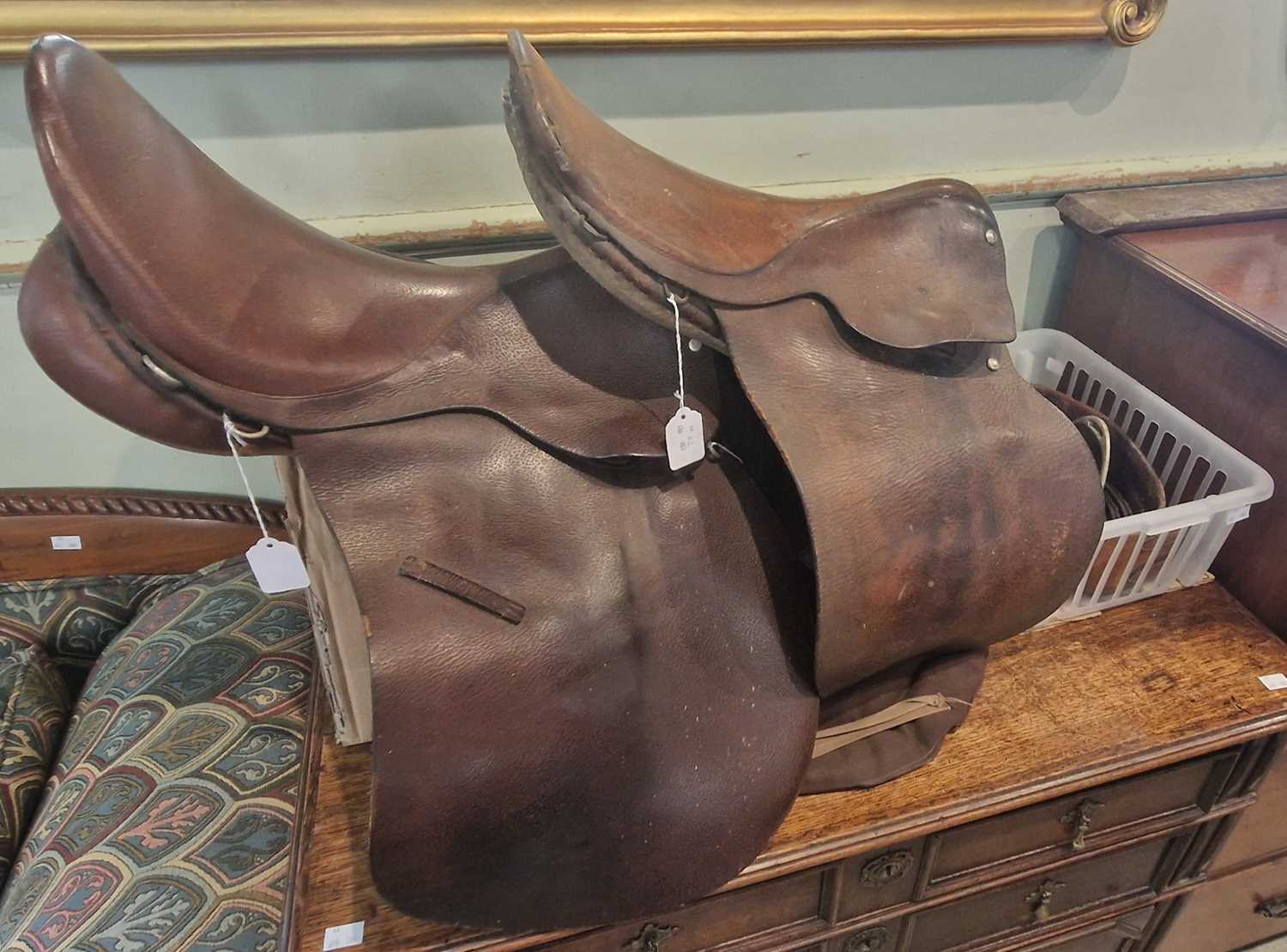 Lot 664 - Two leather horse saddles together with a