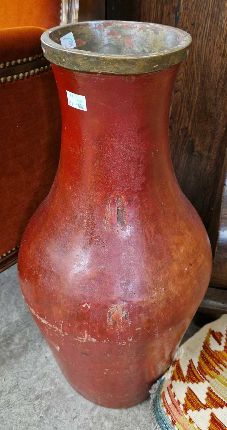 Lot 817 - A large red ground terracotta flagon with