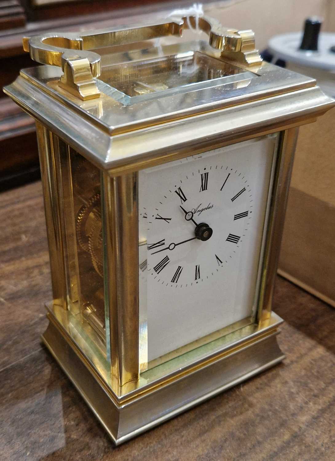 Lot 369 - An English made carriage clock by 'Angelus',