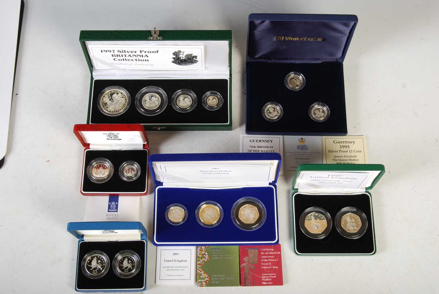 Lot 209 - Six cased proof coin collections to include