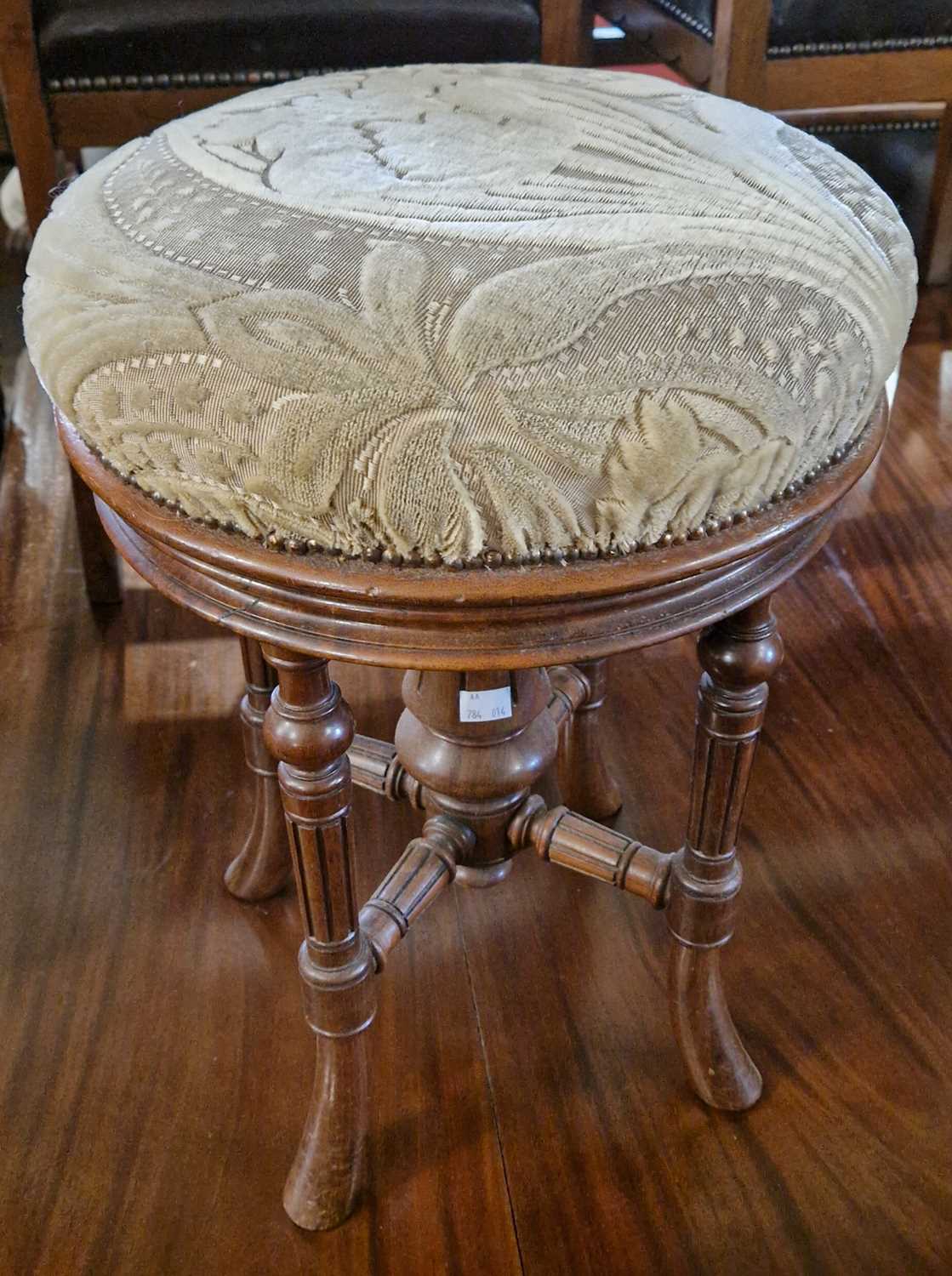 Lot 778 - An Antique mahogany circular piano stool,