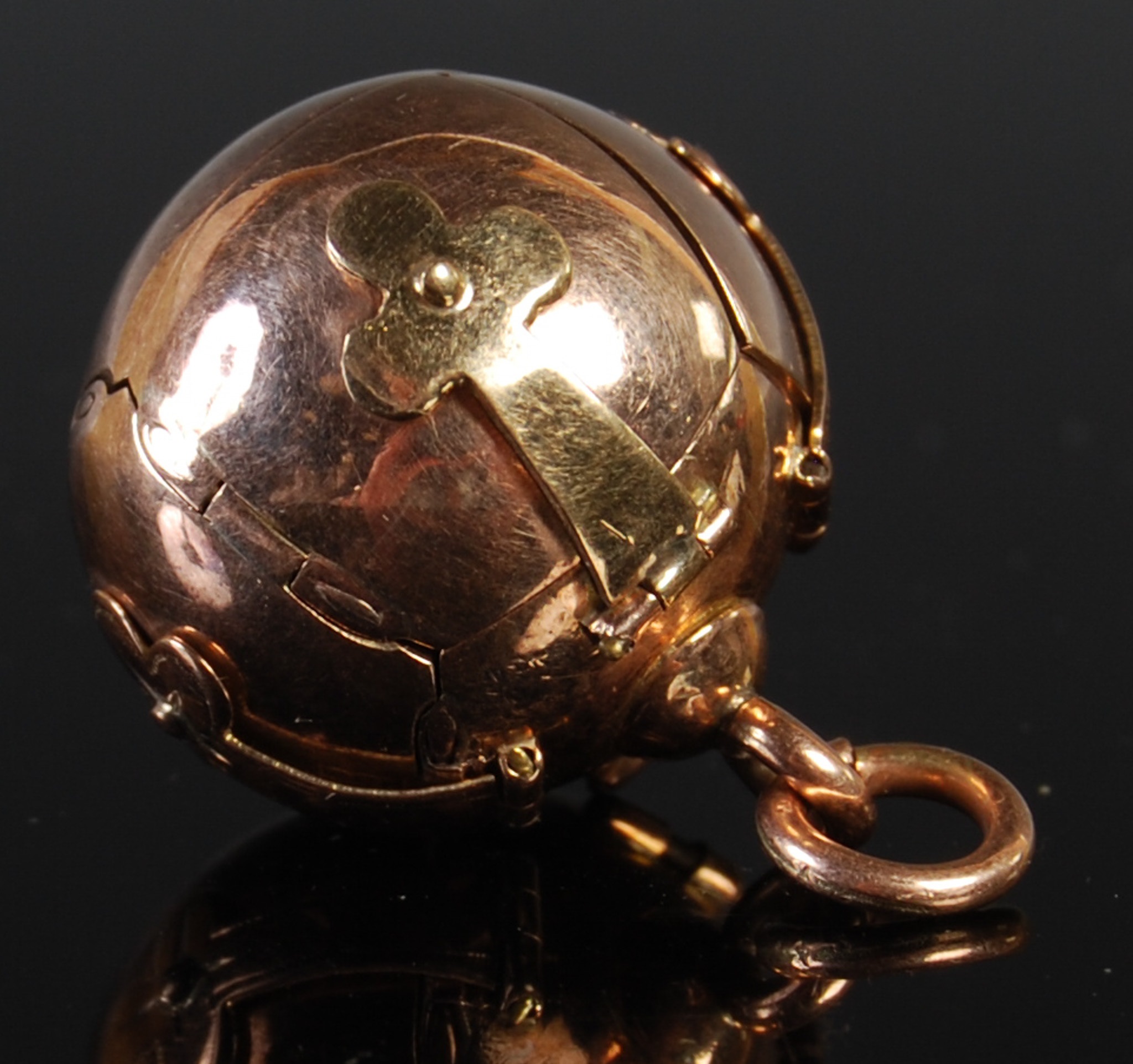 Lot 42 - A yellow metal Masonic orb-shaped metamorphic