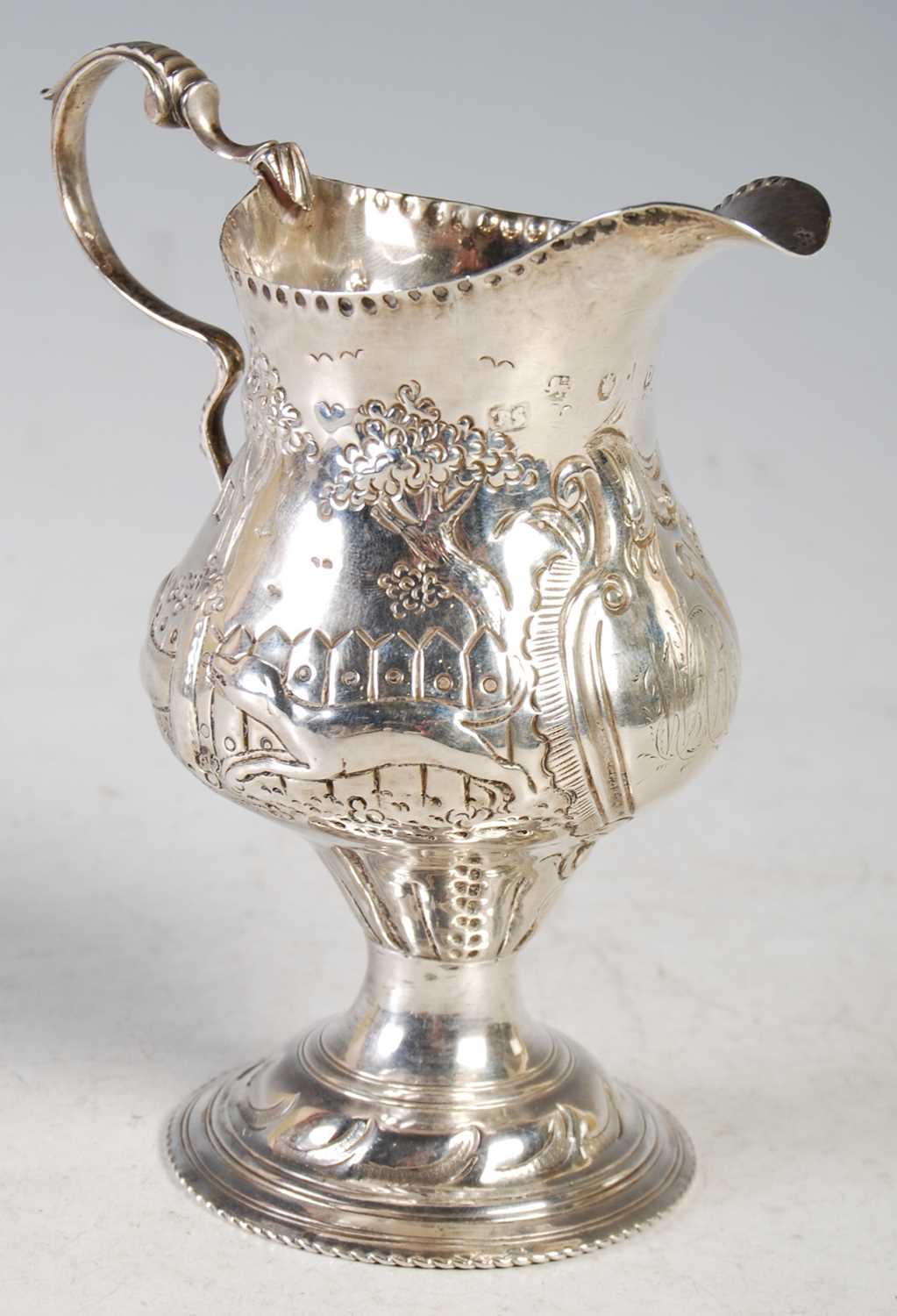 Lot 102 - A George III silver pear-shaped cream jug,