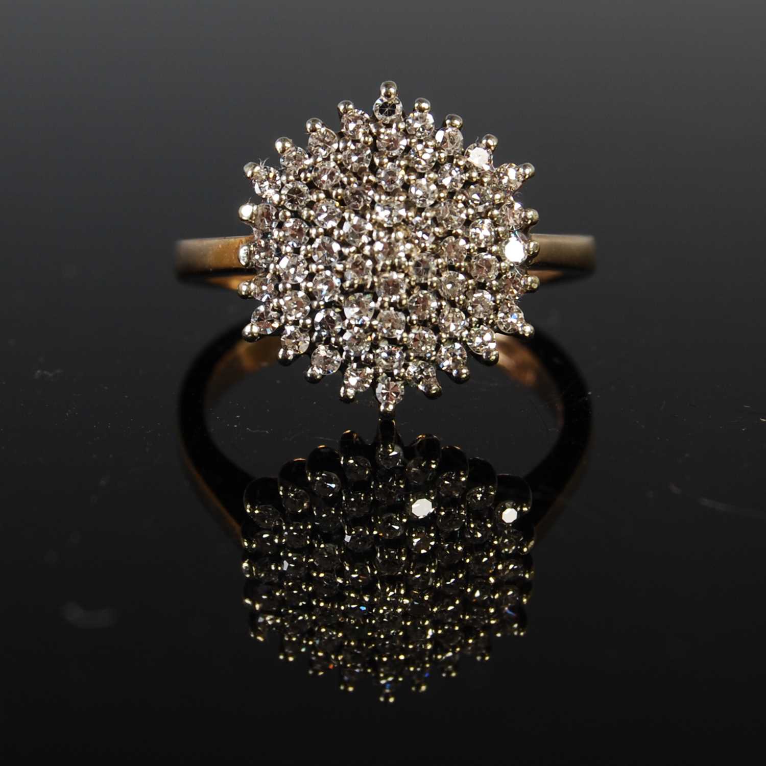 Lot 291 - A 9ct gold and diamond chip cocktail ring,