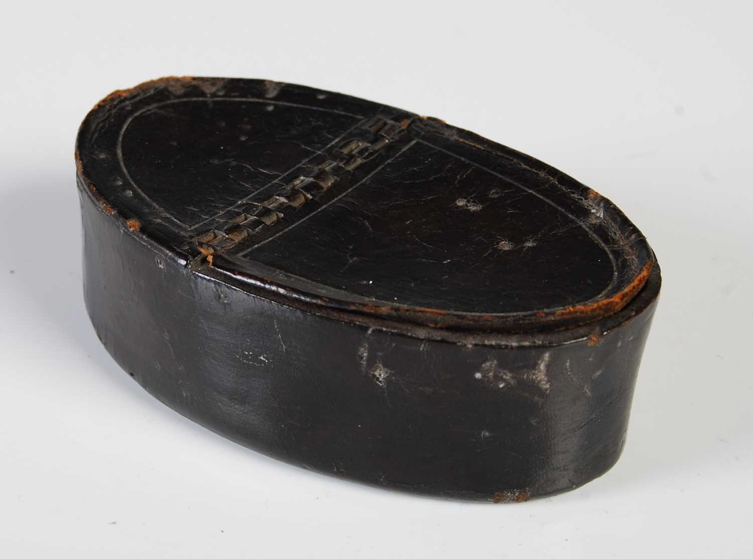 Lot 360 - A late 18th century leather oval snuff box,