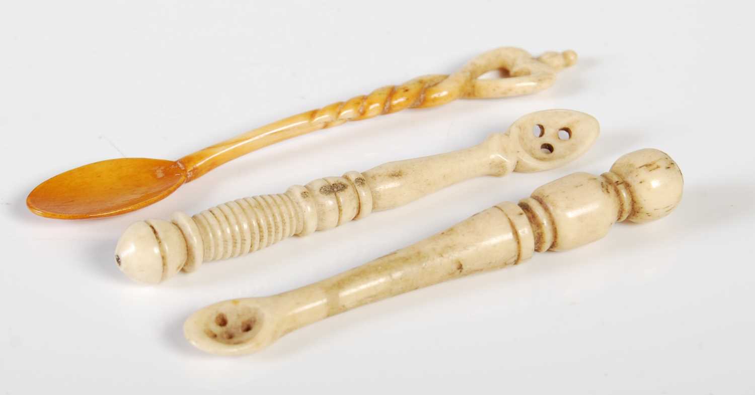 Lot 381 - Three 19th century bone snuff spoons,