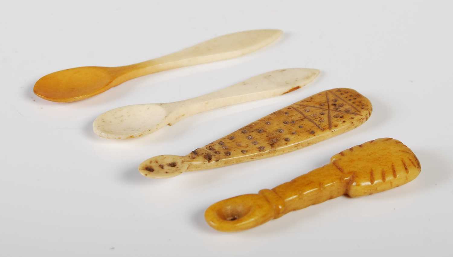 Lot 319 - Four 19th century bone snuff spoons,