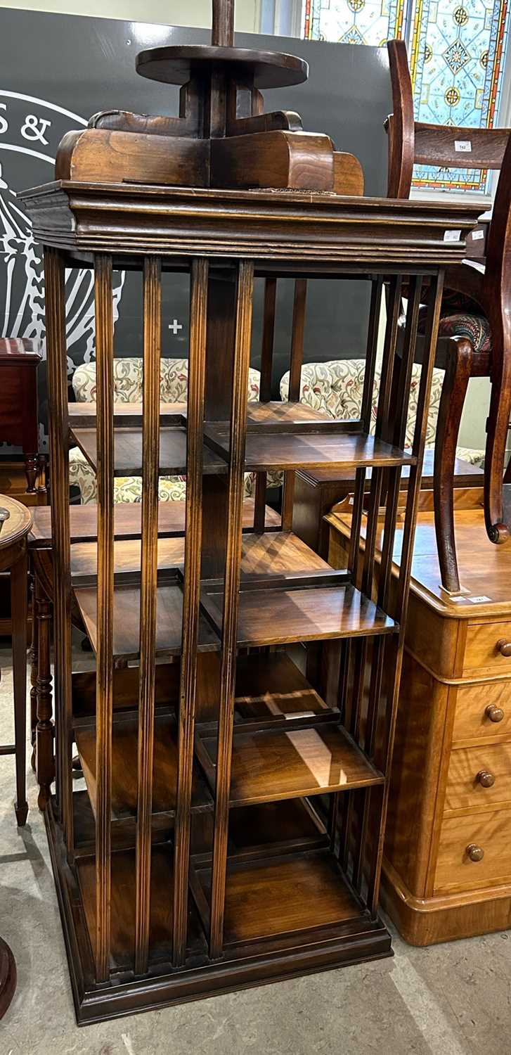 Lot 740 - A tall square revolving bookcase, 160cm high