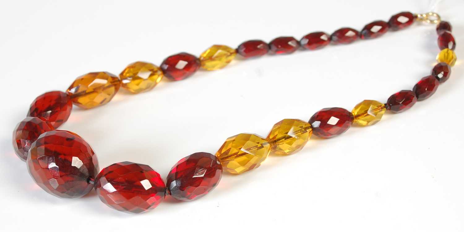 Lot 326 - A red and yellow amber type faceted
