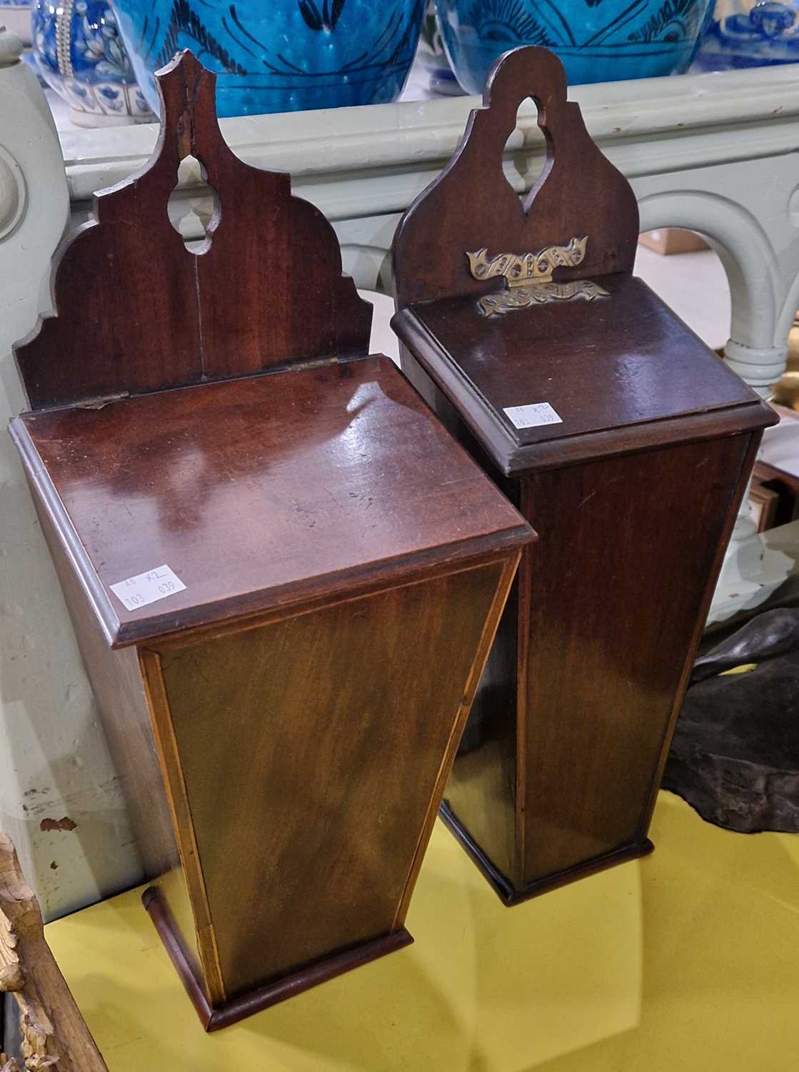 Lot 486 - Two antique mahogany candle boxes,