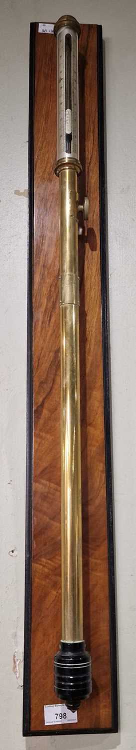 Lot 798 - A brass stick barometer on walnut and