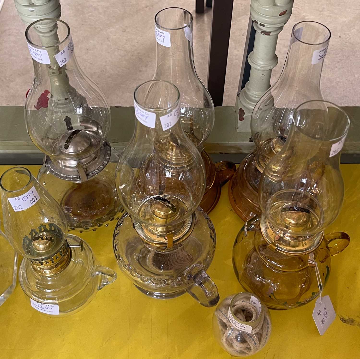 Lot 486 - Six assorted oil burning paraffin lamps,
