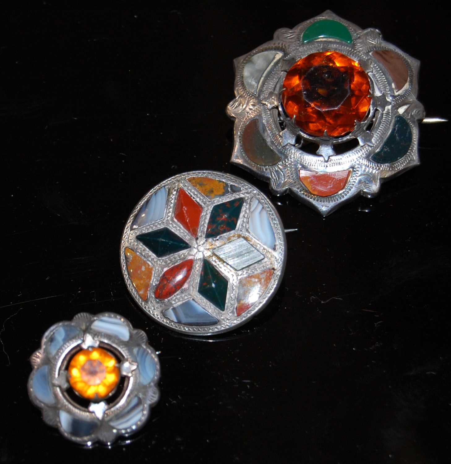 Lot 176 - Three assorted Scottish white metal pebble