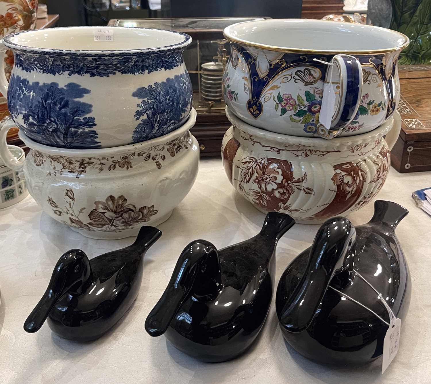 Lot 491 - Four assorted chamber pots and three black