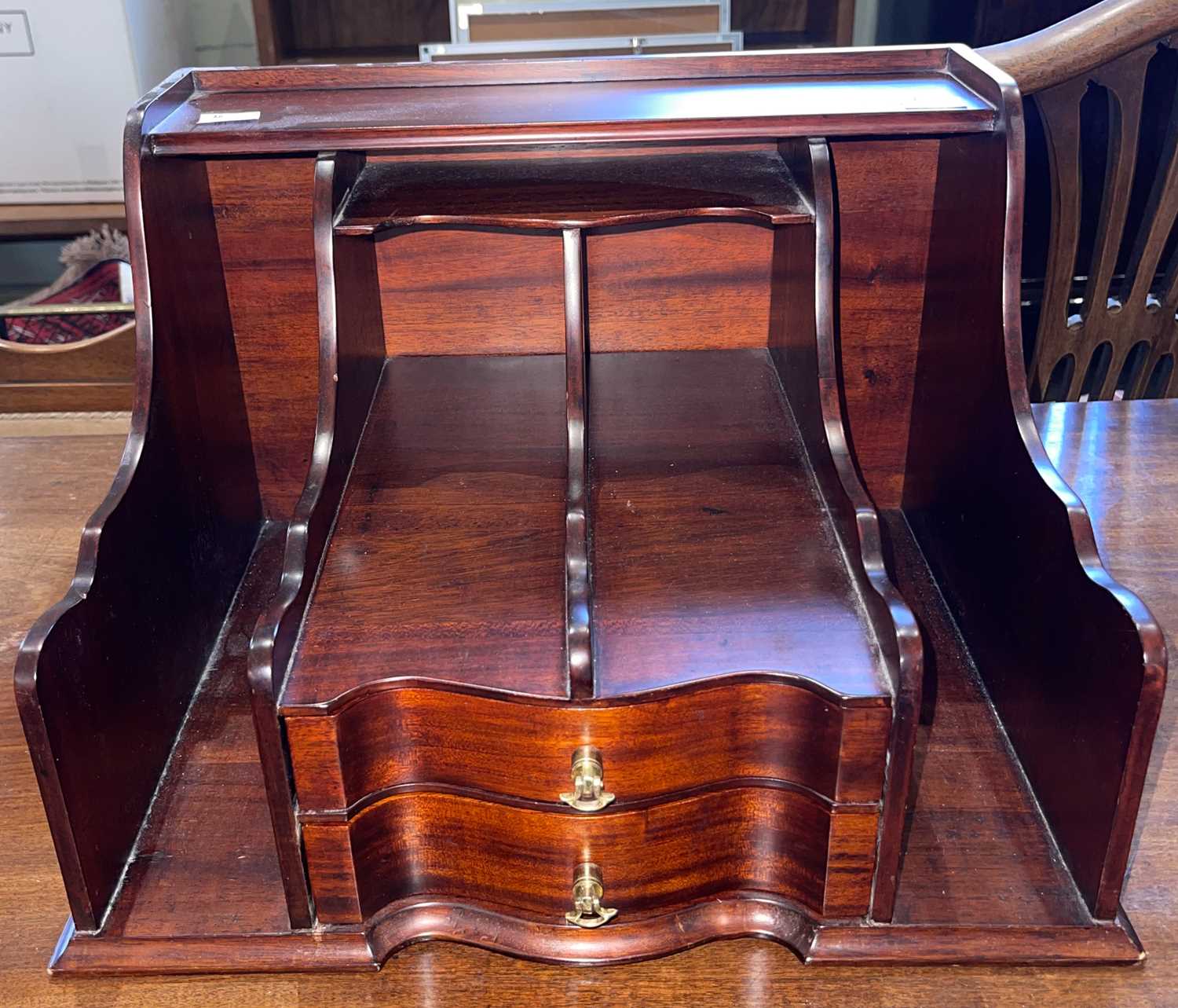 Lot 904 - A reproduction mahogany table-top desk tidy,