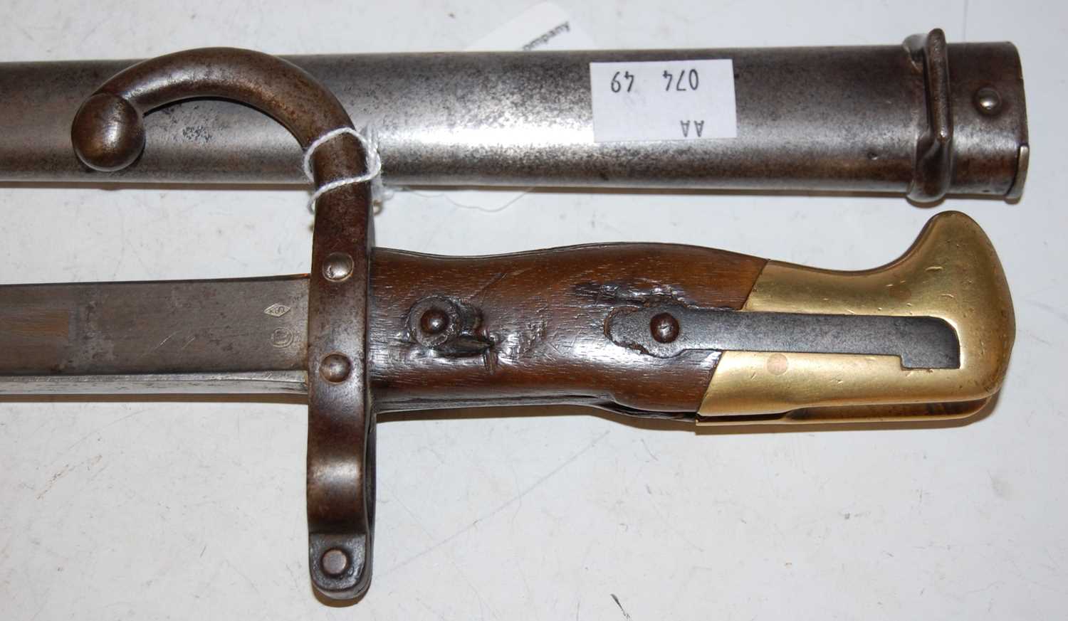 Lot 81 - A late 19th century French Bayonet, inscribed