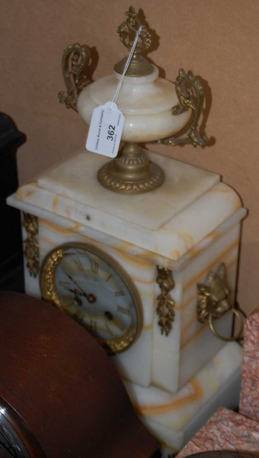 Lot 362 - A white marble mantel clock with brass