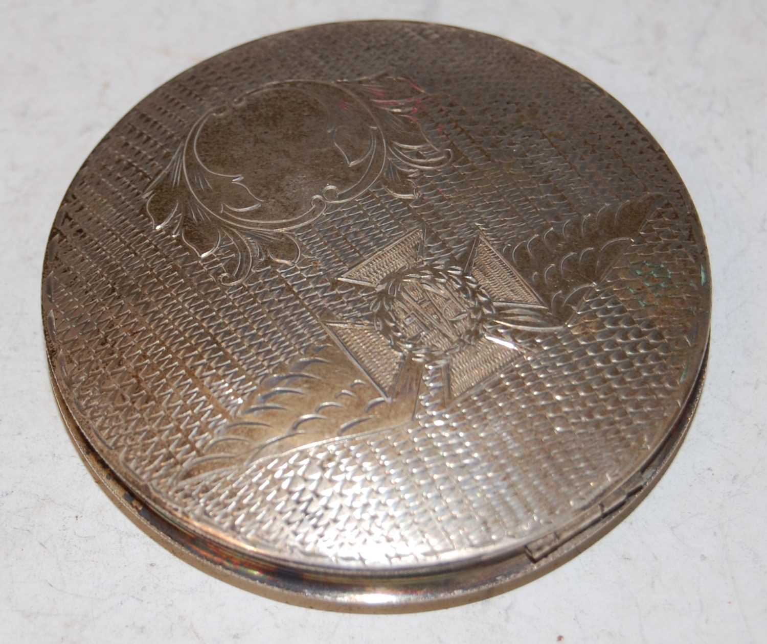 Lot 224 - A Continental white metal circular box,
