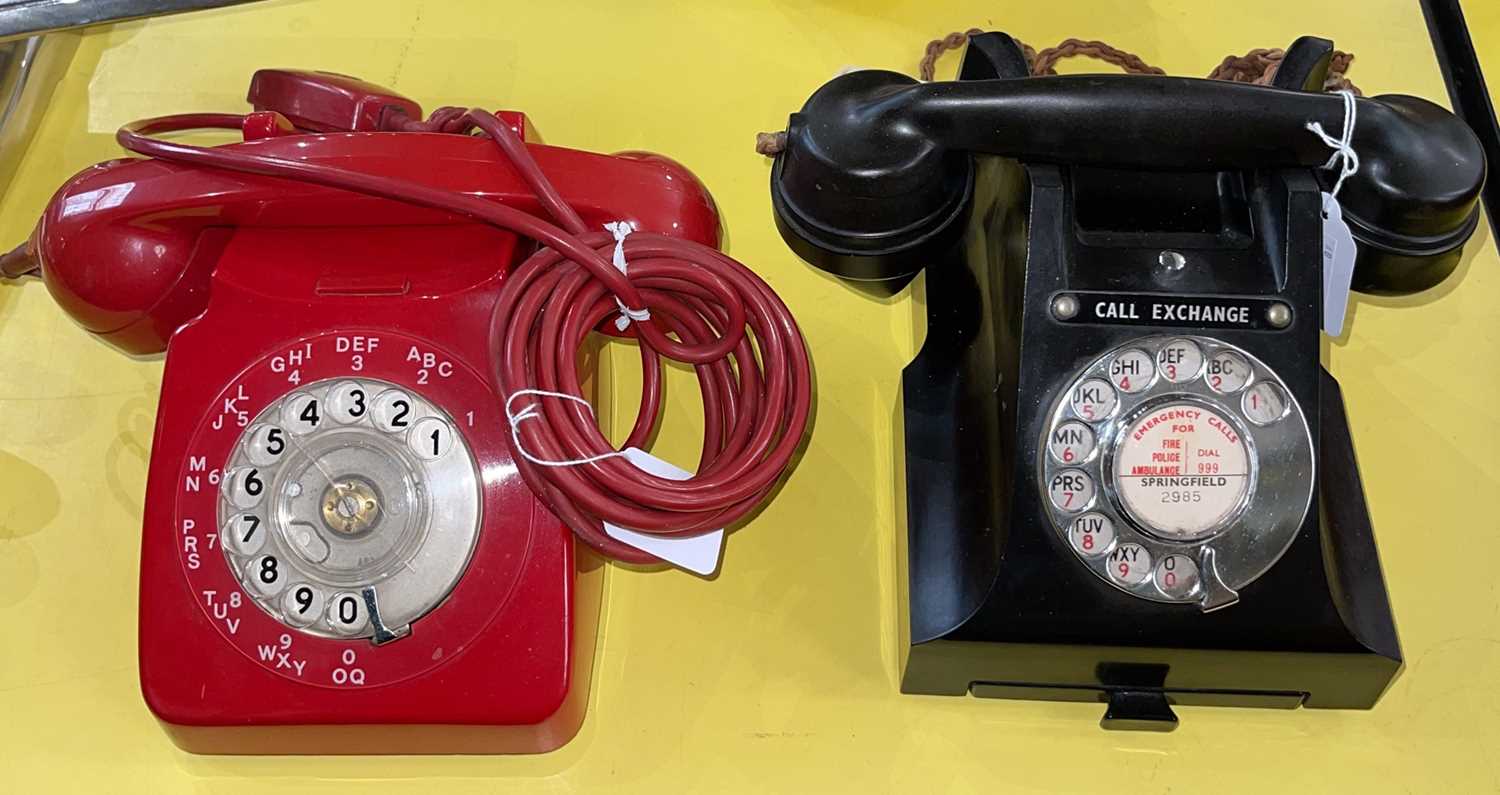 Lot 392 - A vintage GPO Rotary dial telephone in red;