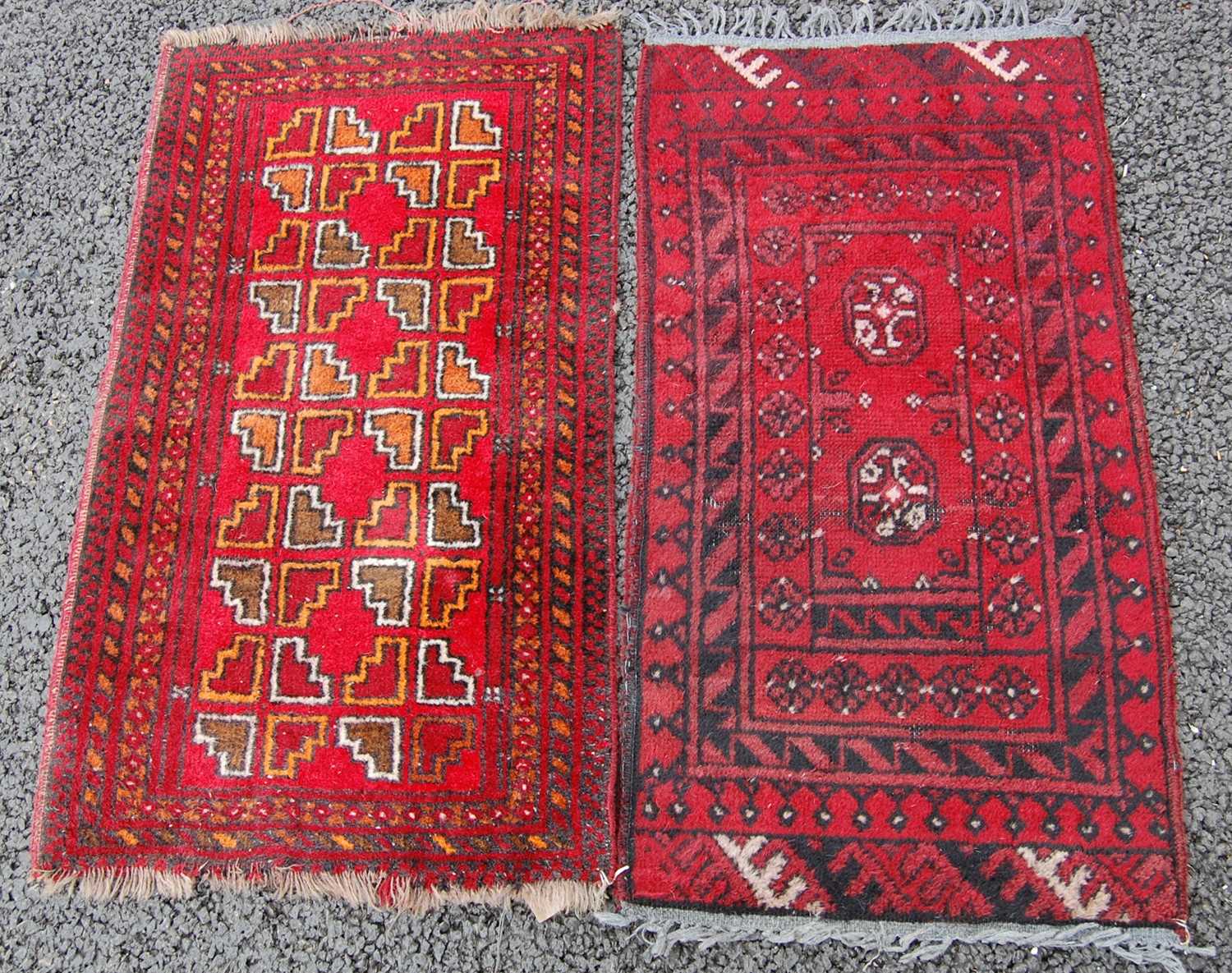 Lot 823 - Two small Persian style rugs, one decorated
