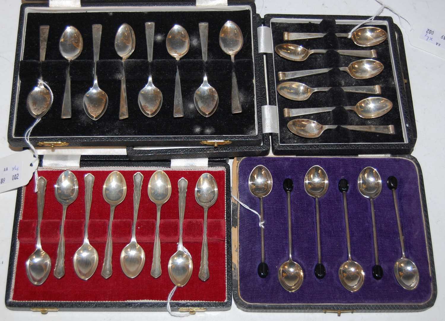 Lot 143 - Four cased sets of silver coffee spoons, to