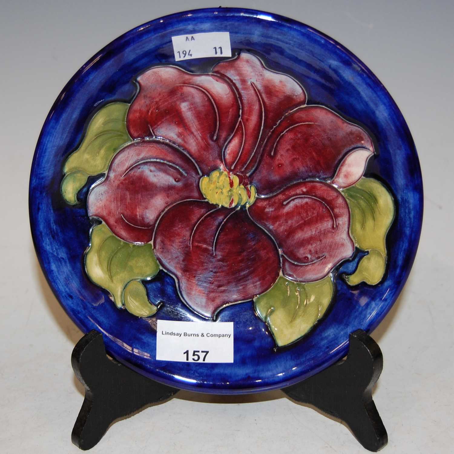 Lot 157 - A Moorcroft blue ground dish, decorated with