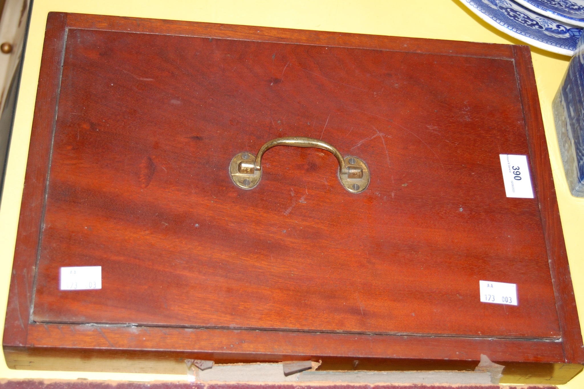 Lot 390 - A mahogany rectangular box with brass handle,