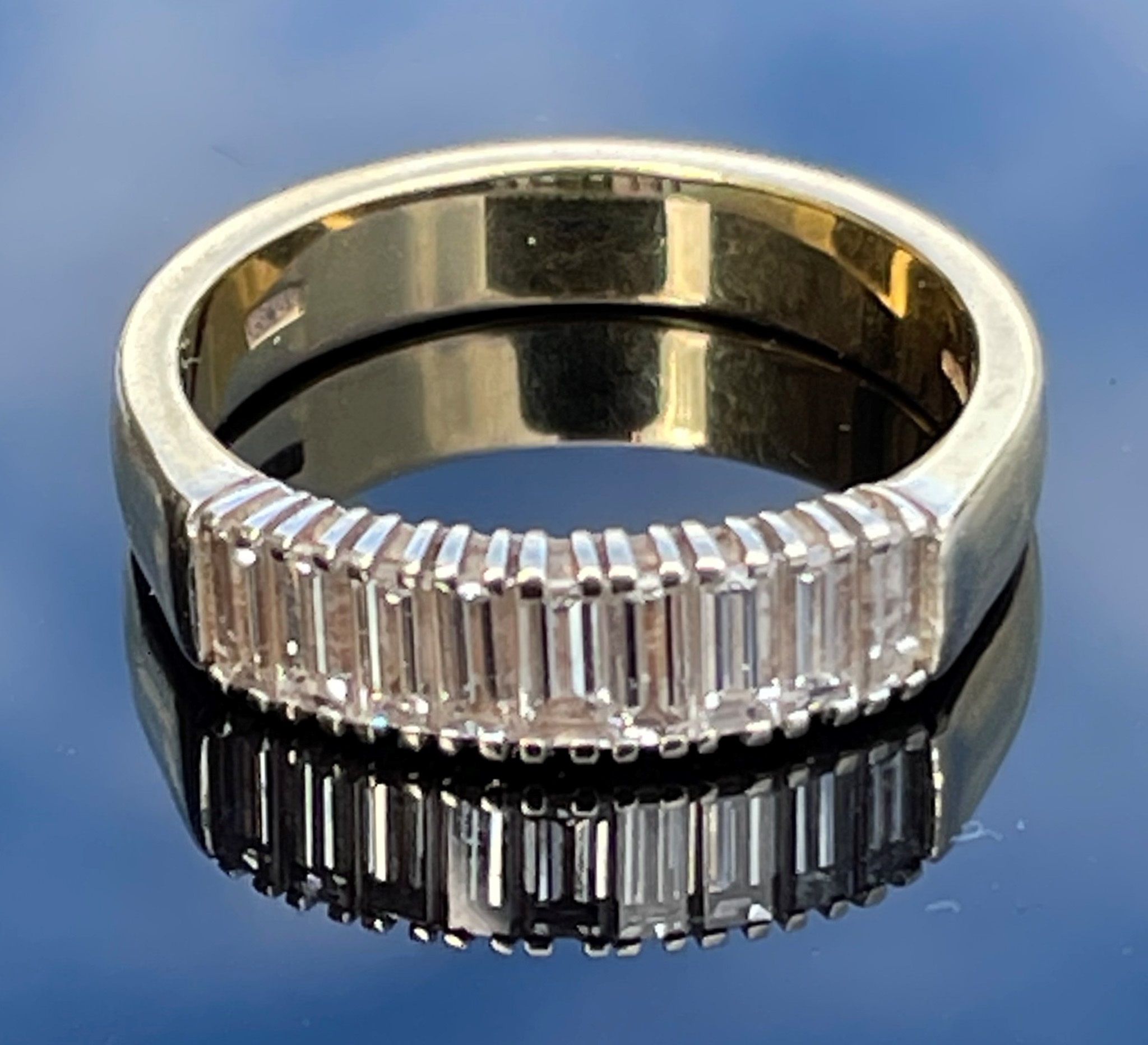 Lot 221 - An 18ct gold and nine stone diamond set ring,