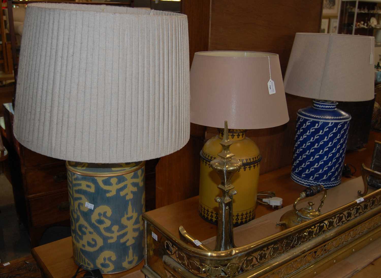 Lot 704 - A group of three contemporary tea tin table