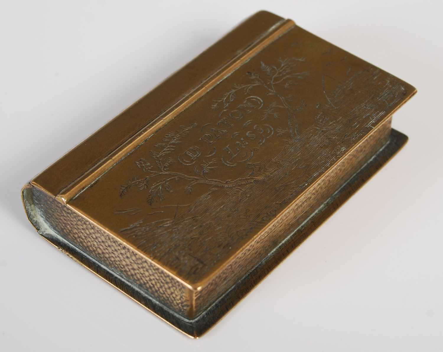 Lot 205 - An unusual brass snuff box in the form of a