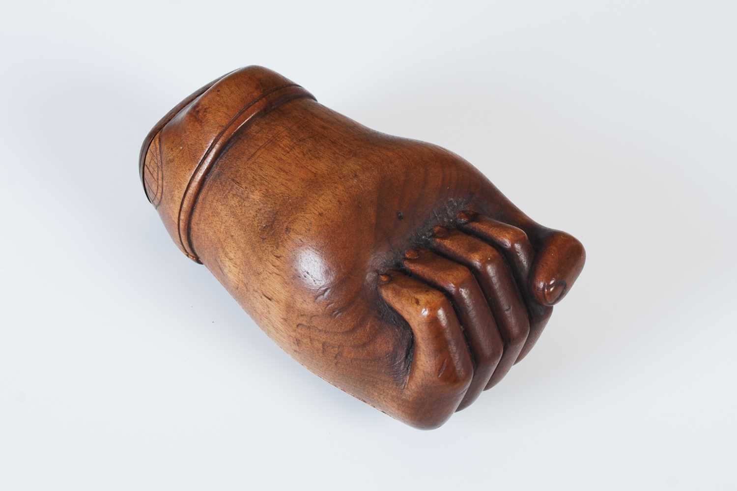 Lot 209 - A rare treen snuff box formed as a hand,