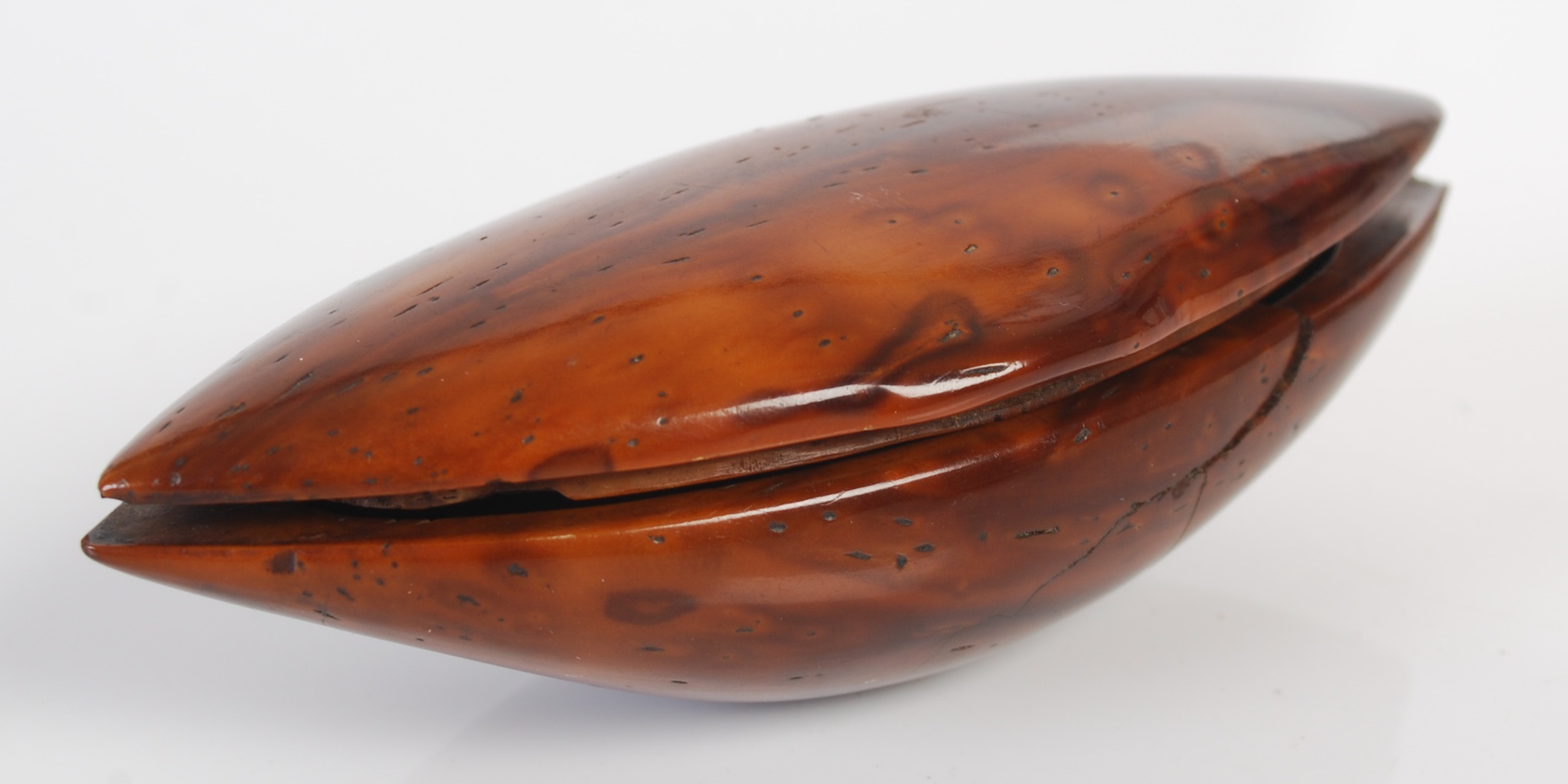 Lot 248 - A coquilla nut shuttle-shaped snuff box,