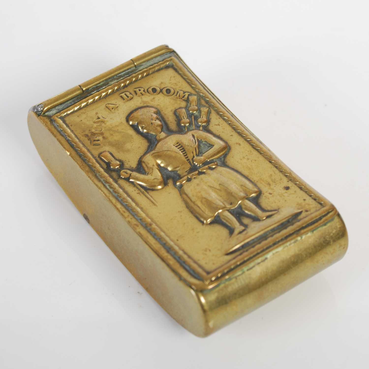 Lot 249 - A brass curved oblong snuff box,