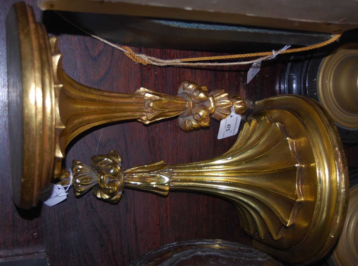 Lot 475 - A pair of composite gilt-coloured wall