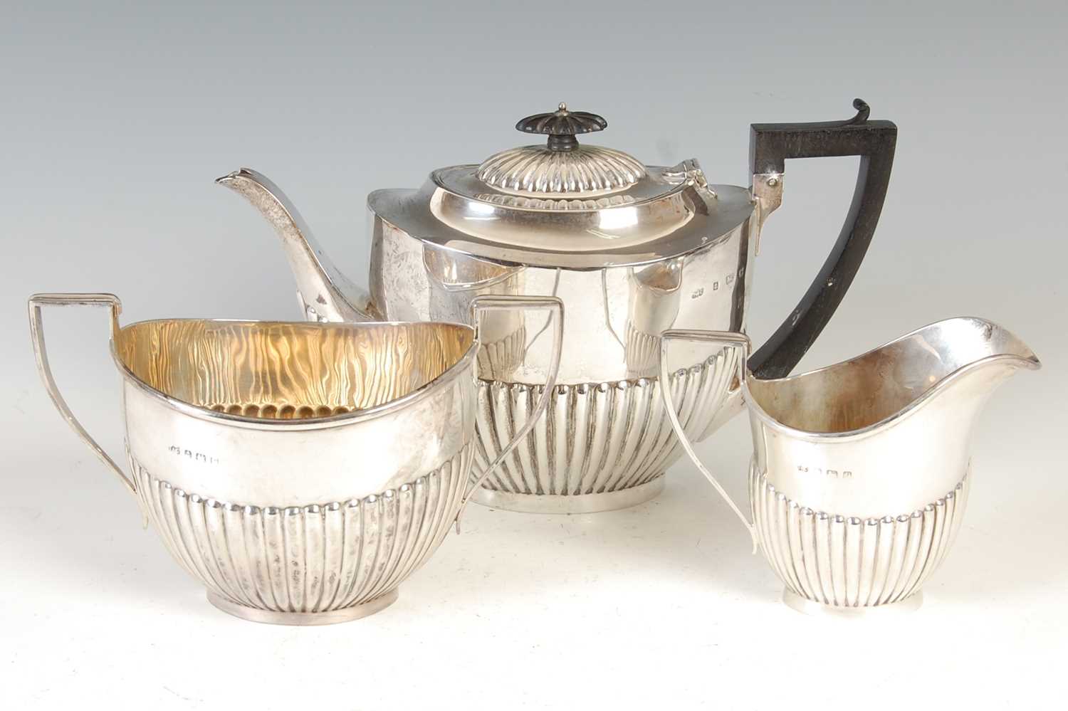 Lot 420 - An early 20th century three piece silver tea