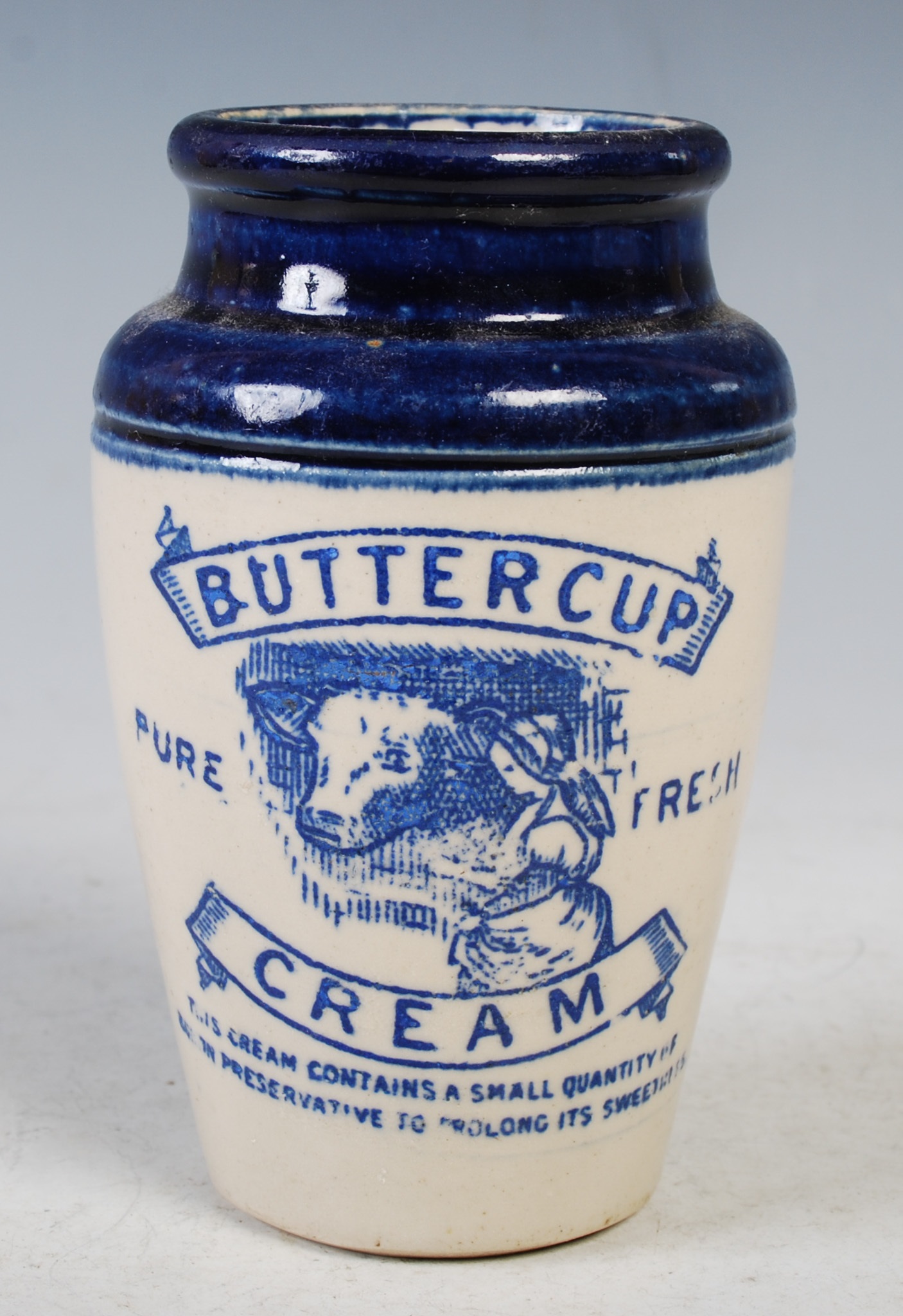Lot 15 - A vintage stoneware Buttercup Cream butter