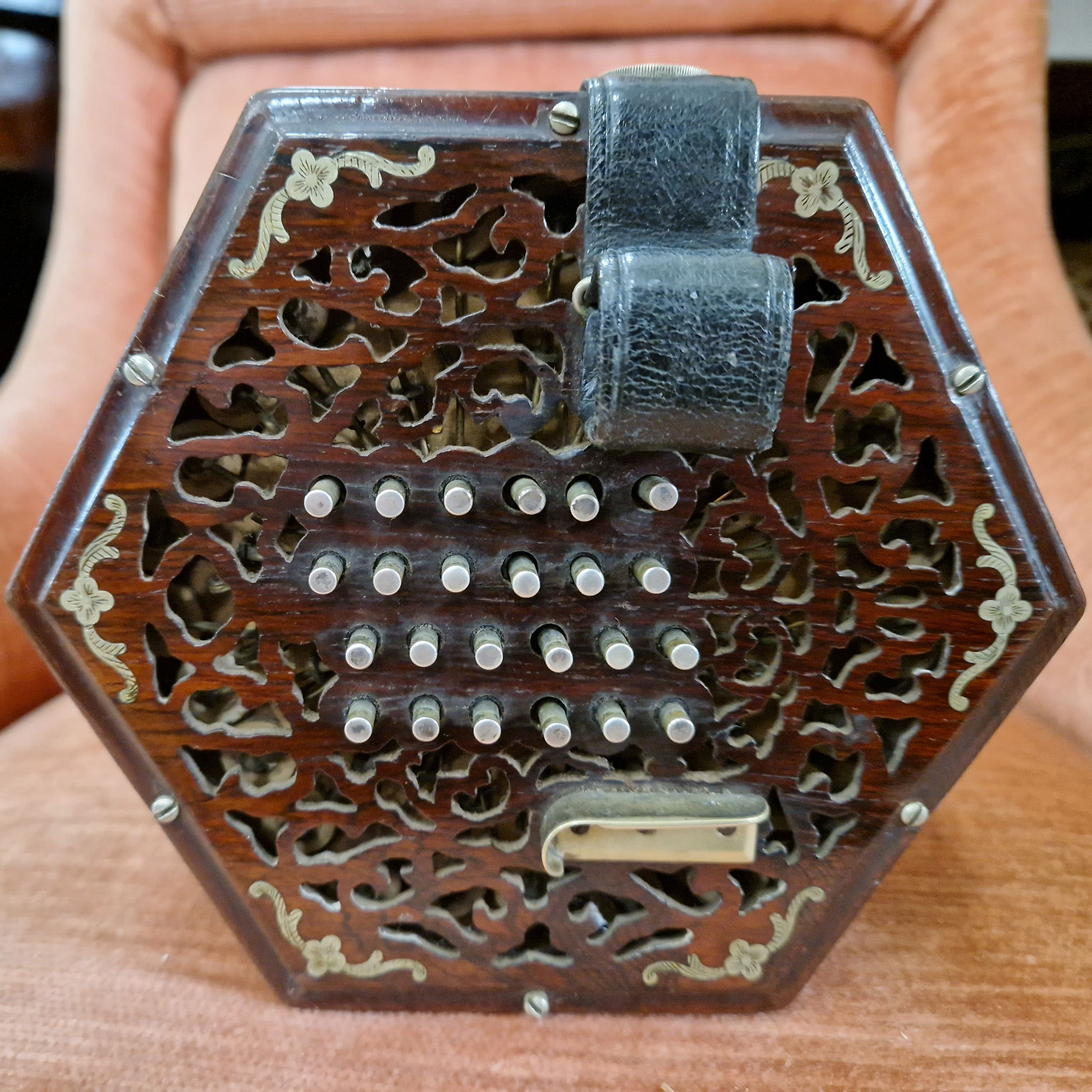 Lot 454 - An antique squeeze box with fret-cut ends