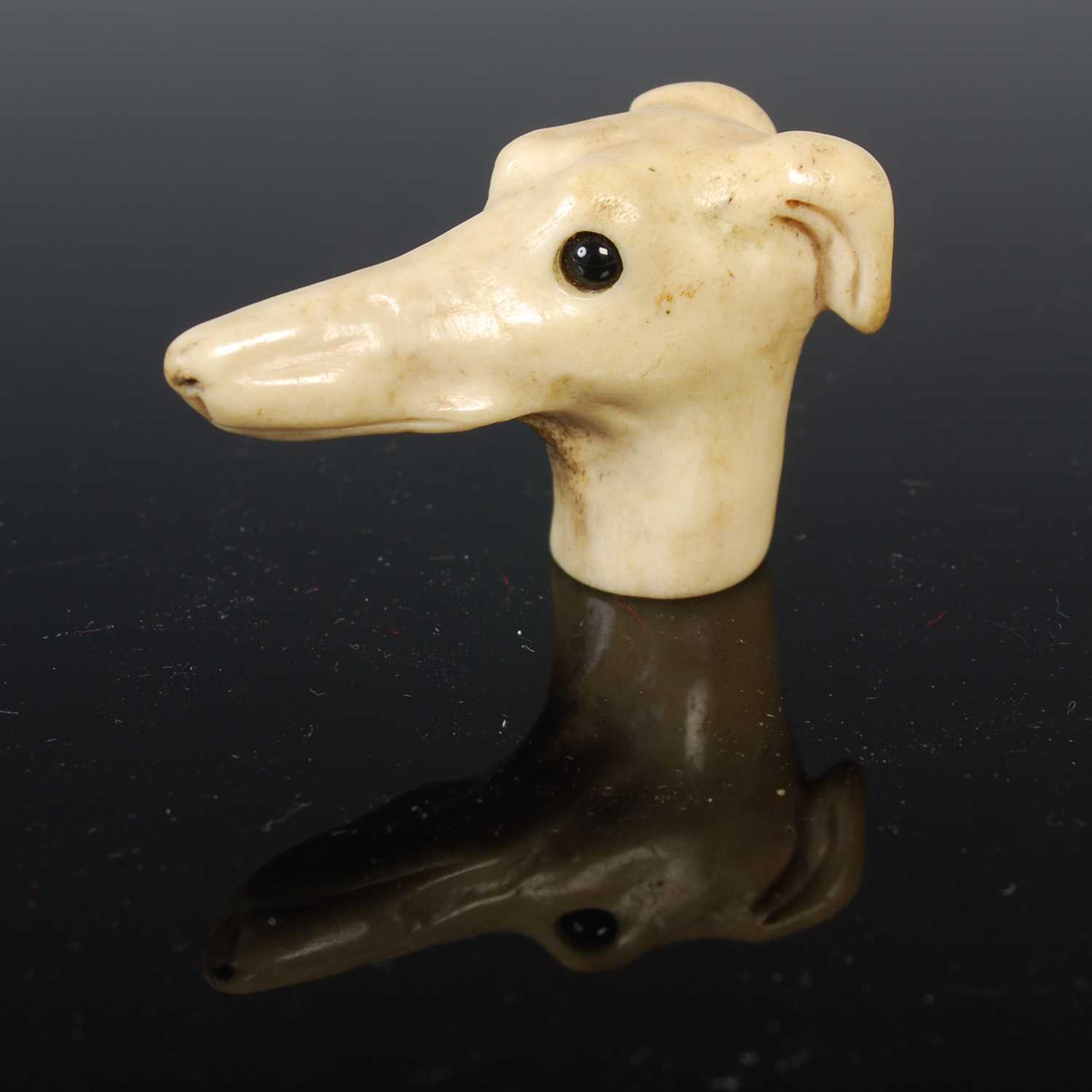 Lot 95 - Dog interest: an antique carved bone walking