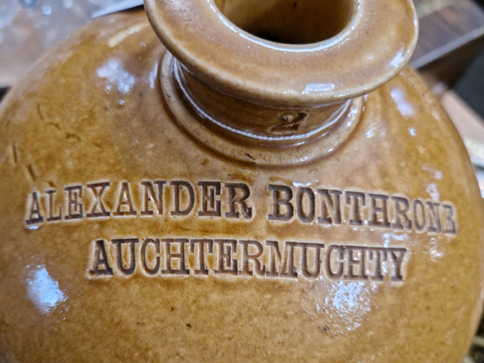 Lot 595 - A stone ware pottery flagon for Alexander