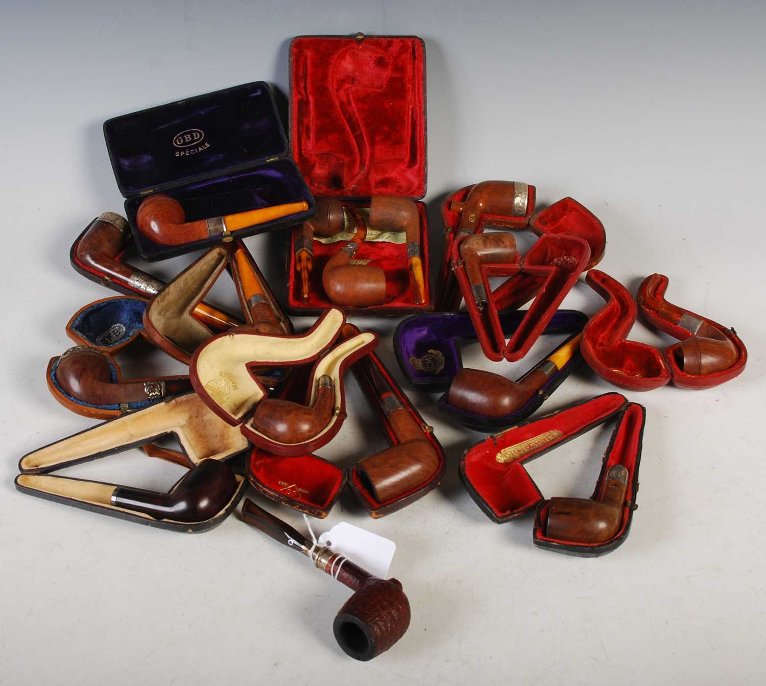 Lot 381 - A collection of silver mounted pipes,