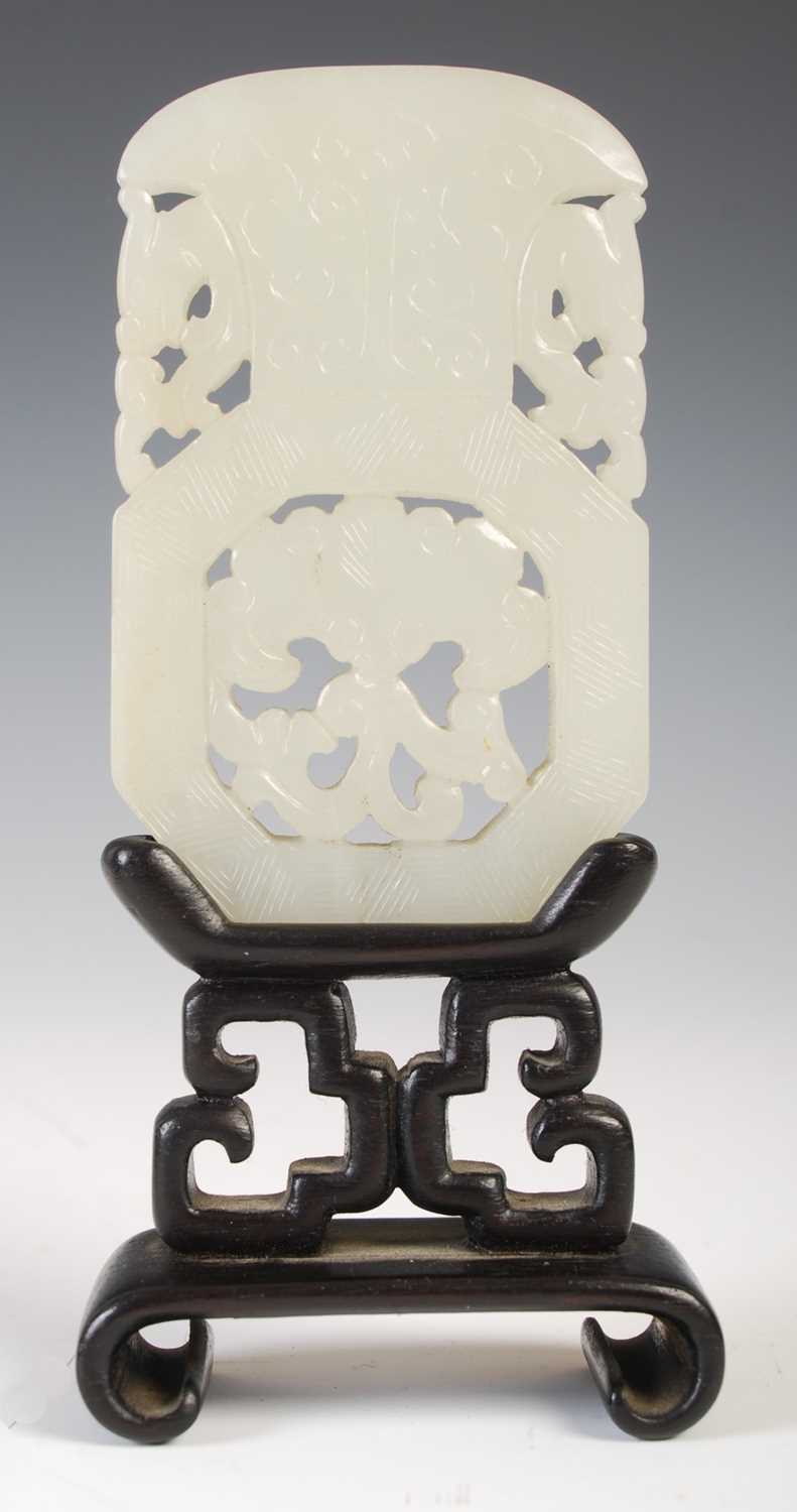 Lot 587 - A Chinese pale celadon jade panel, carved