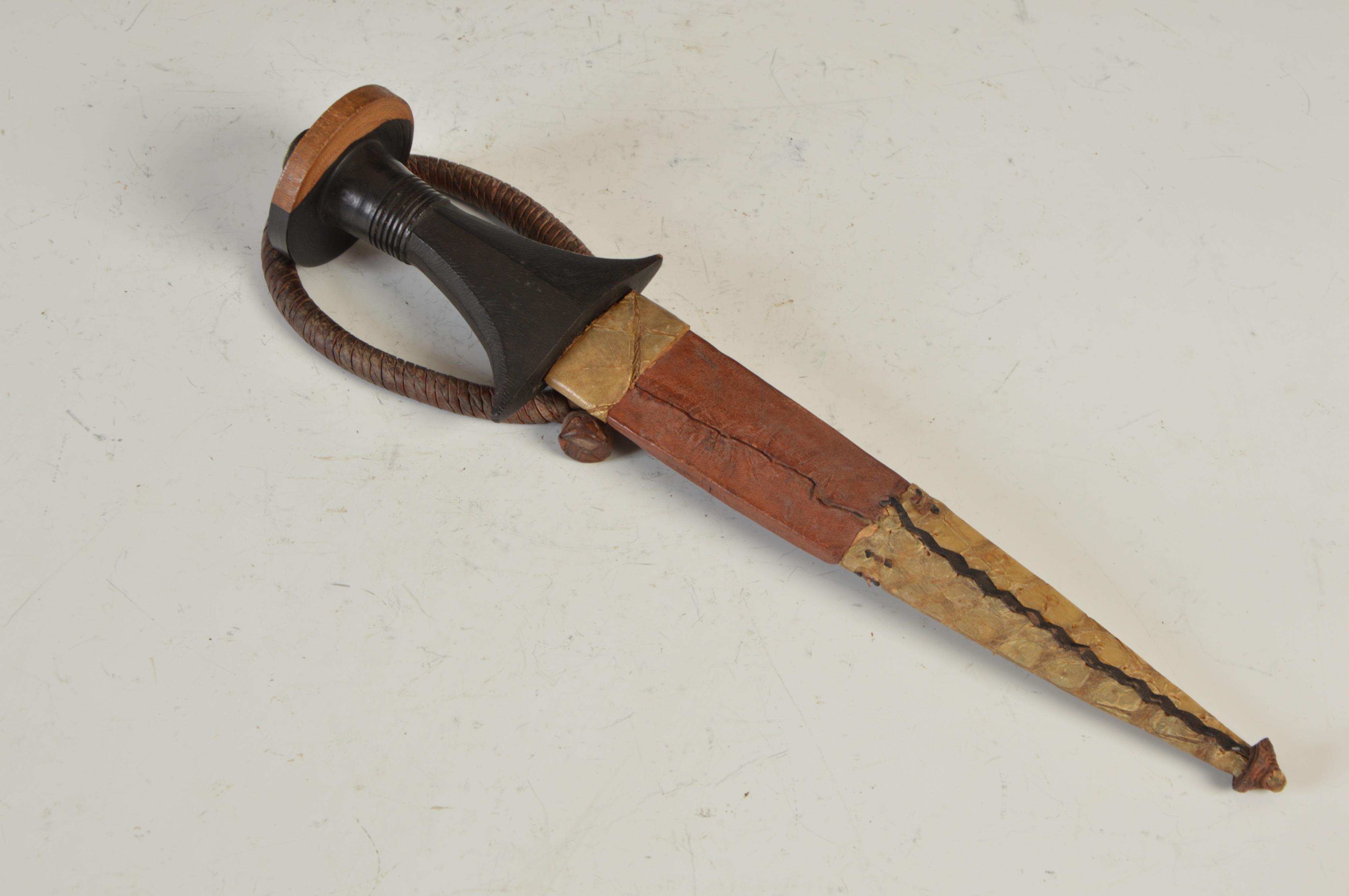 Lot 88 - An early 20th century African arm dagger,