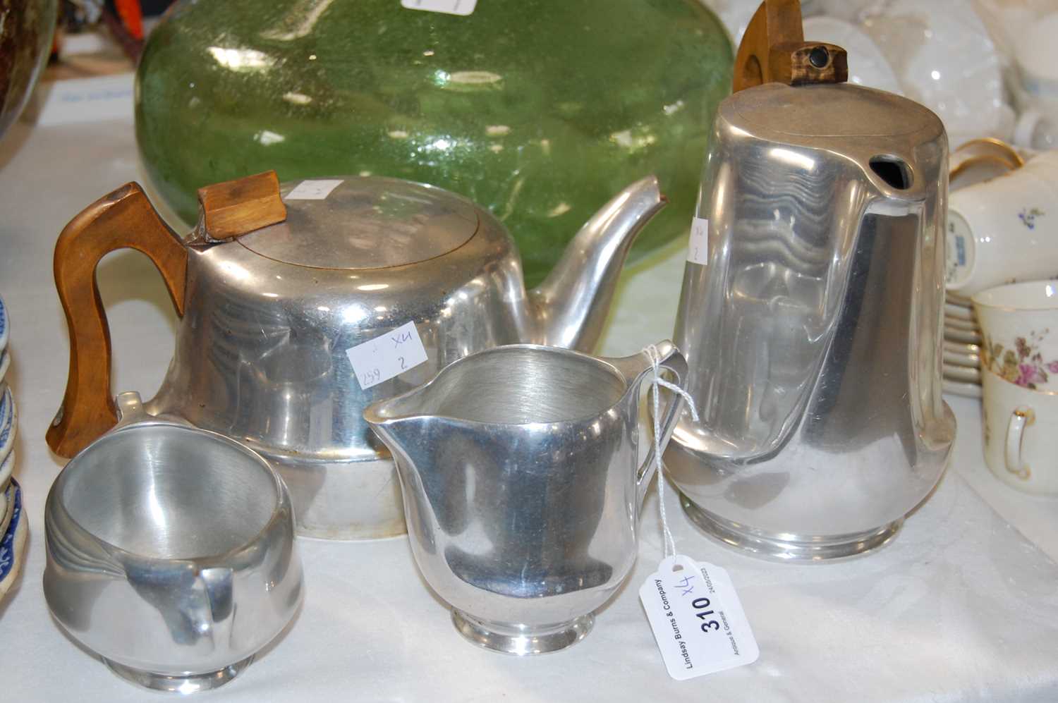 Lot 310 - A four-piece Picqout Ware tea set comprising