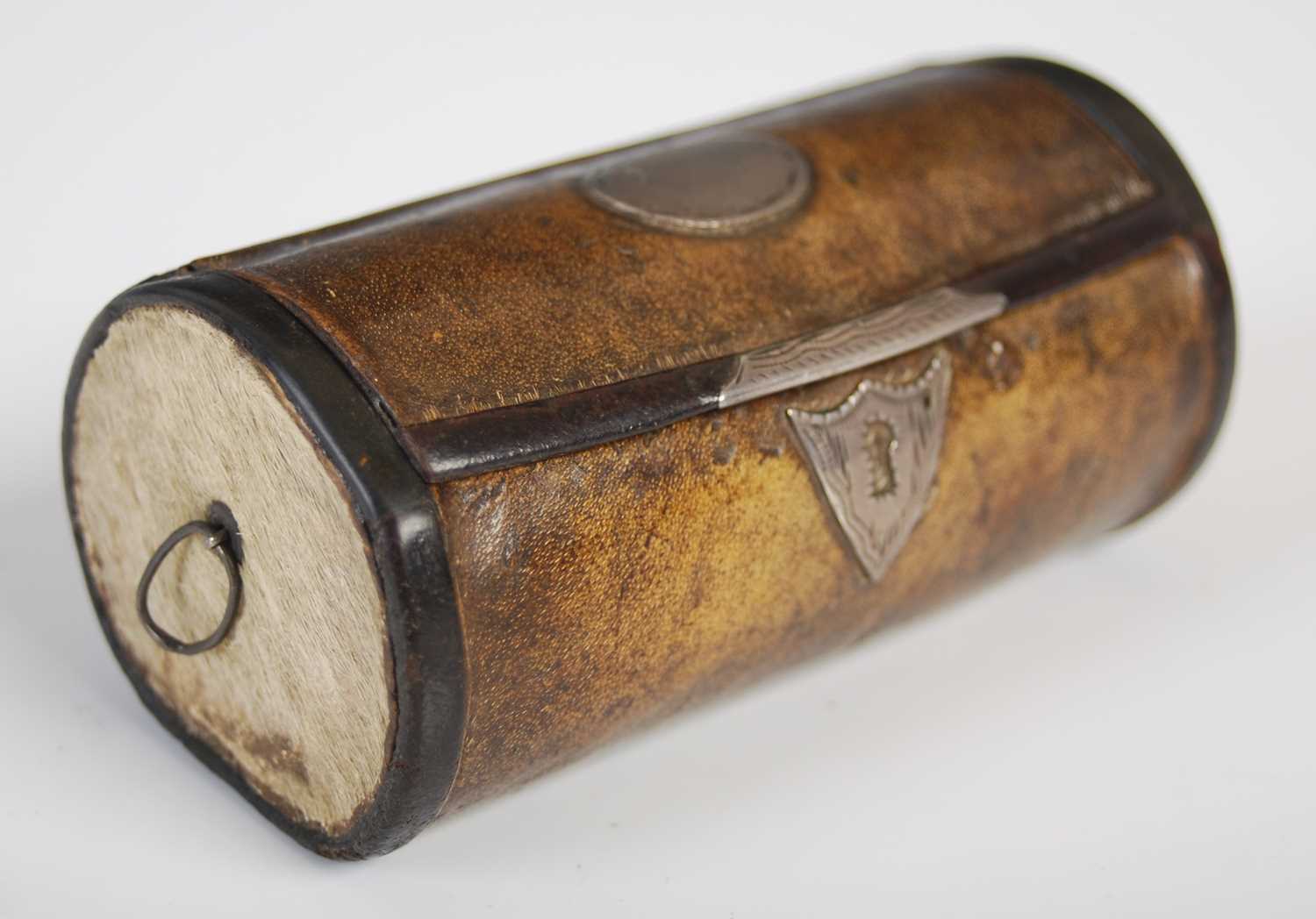 Lot 265 - A leather cylindrical snuff box in the form