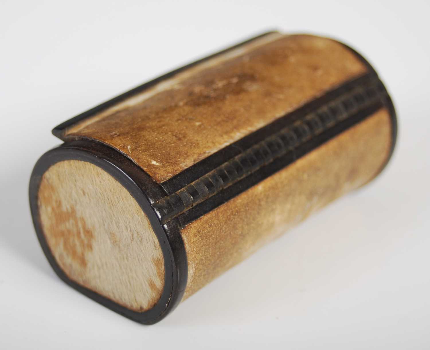 Lot 192 - A small leather cylindrical snuff box in the
