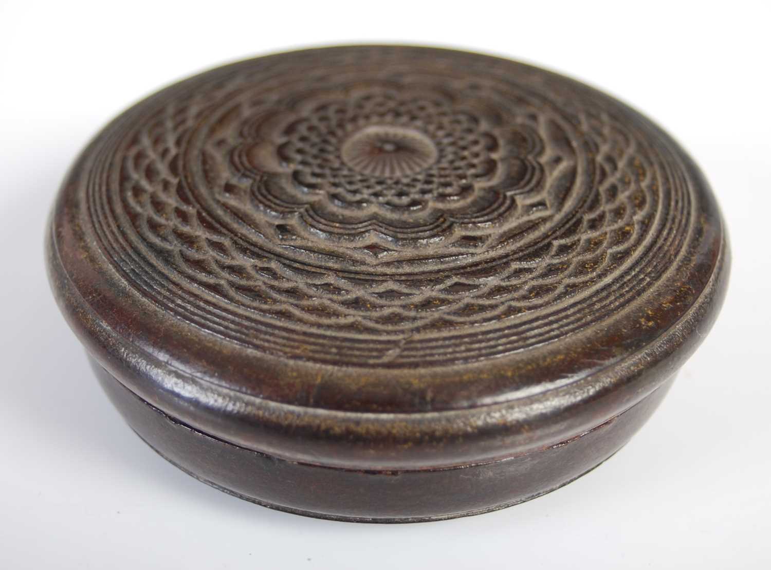Lot 254 - A large pressed leather circular snuff box,