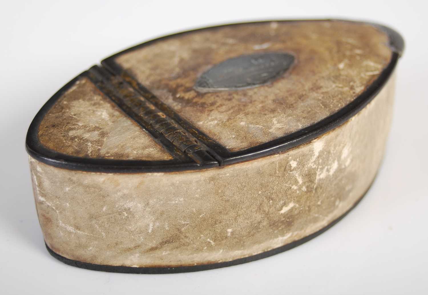 Lot 226 - A leather navette-shaped snuff box, with