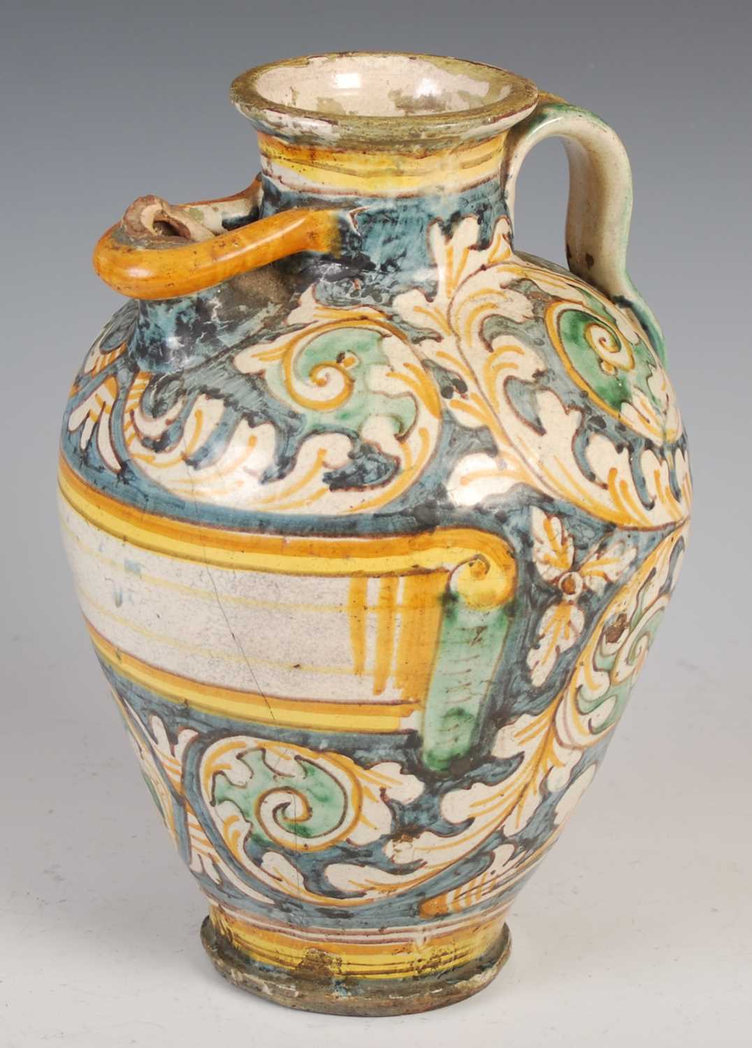 Lot 554 - An antique Maiolica pottery flagon,