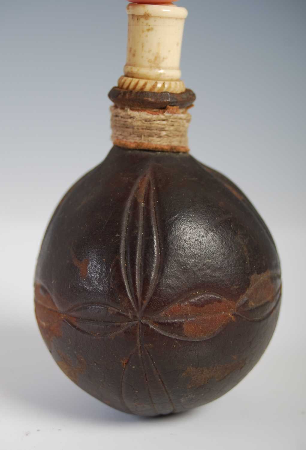 Lot 294 - A nut snuff flask gourd carved with stylised