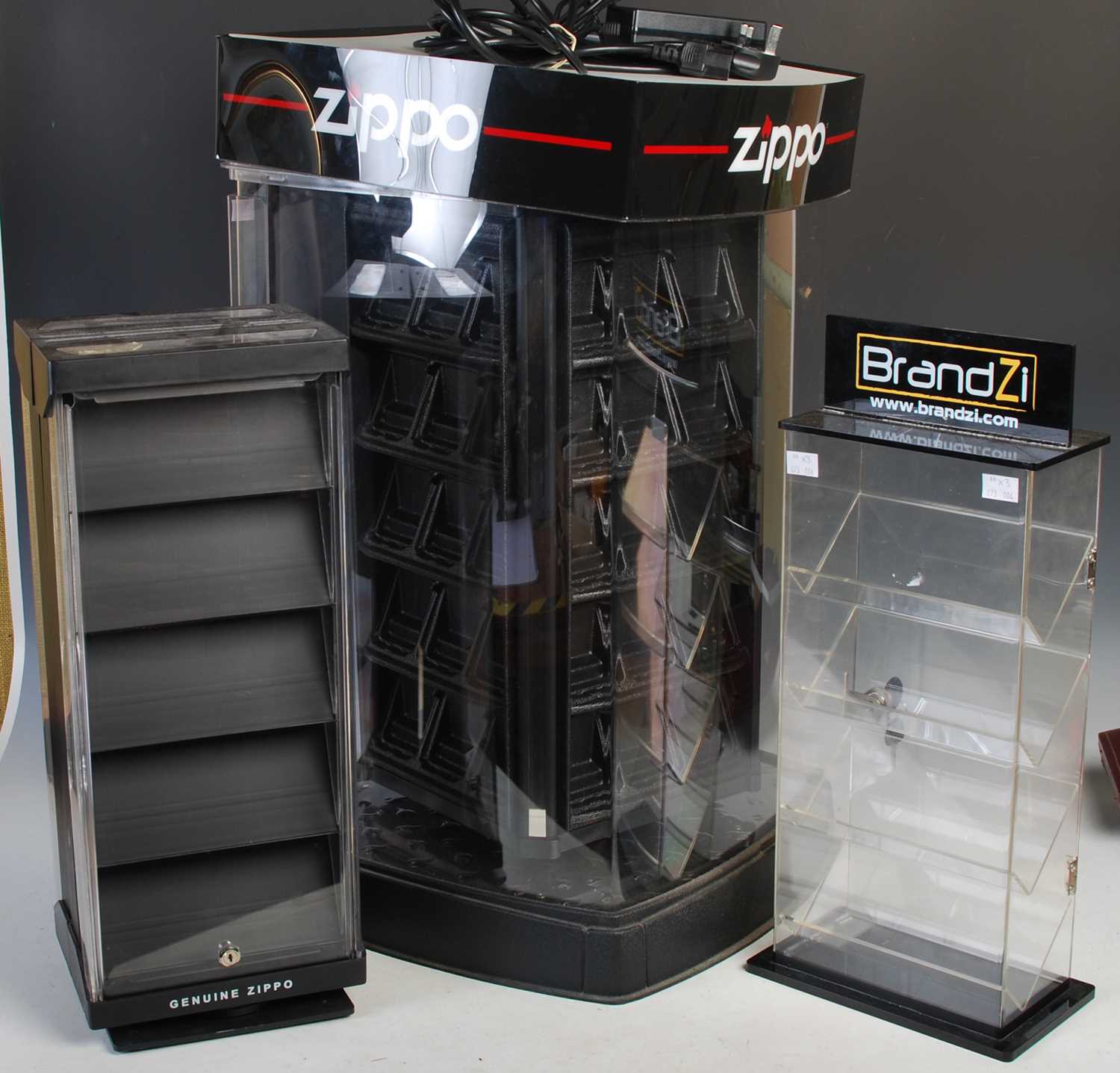 Lot 305 - Two Zippo display cases together with a